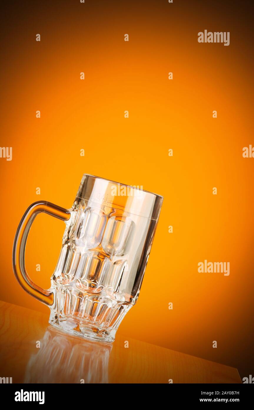 Beer glass against gradient background Stock Photo - Alamy