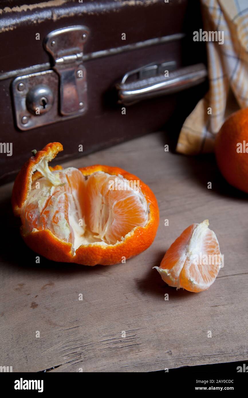 Several of unpeeled whole fresh orange mandarine or oranges, tangerines ...