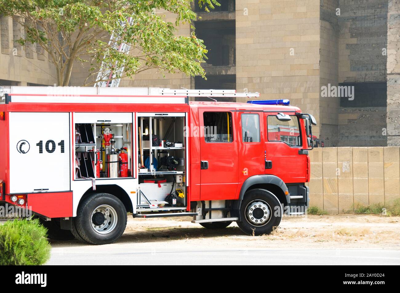 Fire engine at the scene of city fire Stock Photo - Alamy