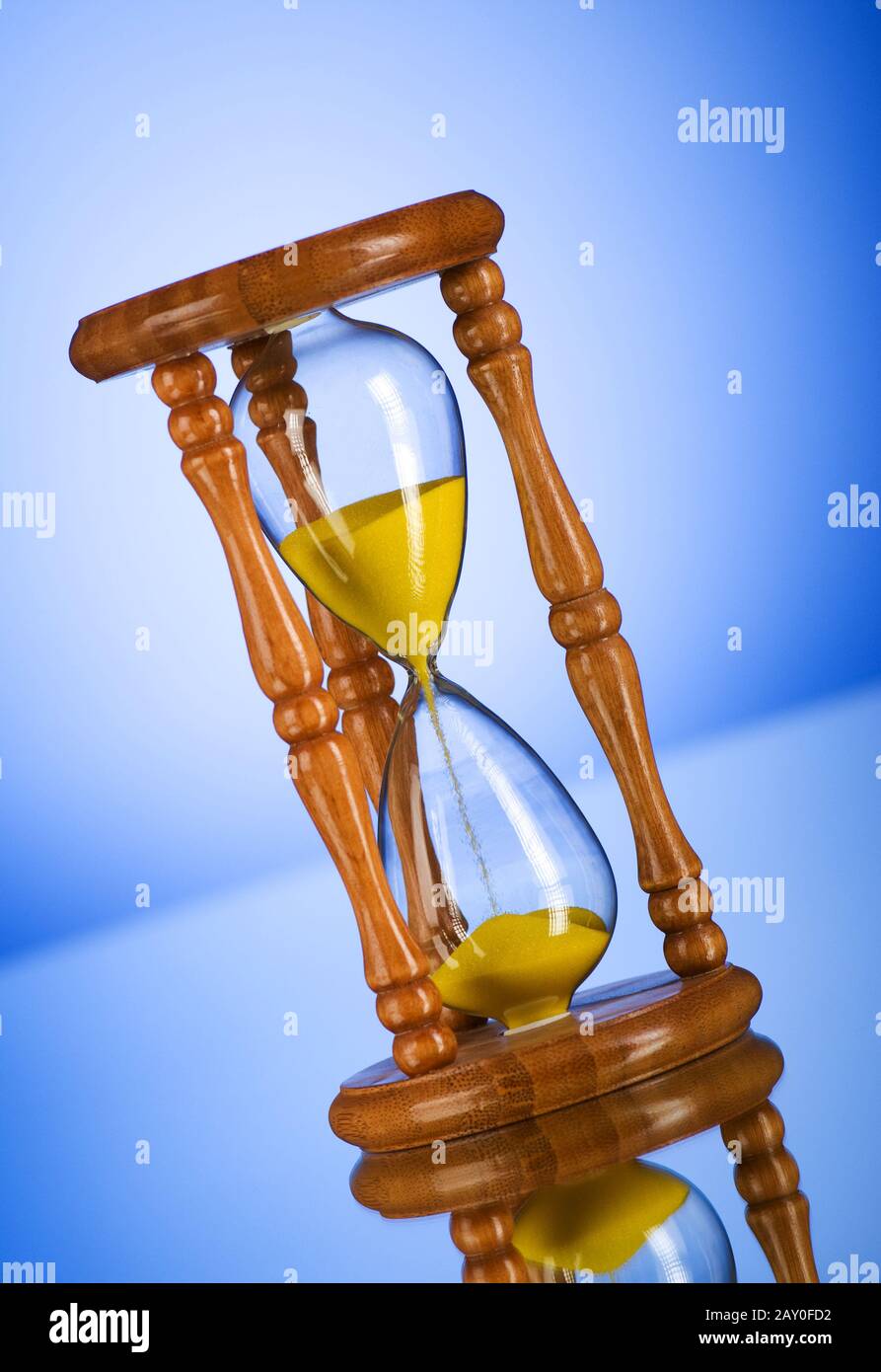 Time concept - hourglass against the gradient background Stock Photo ...