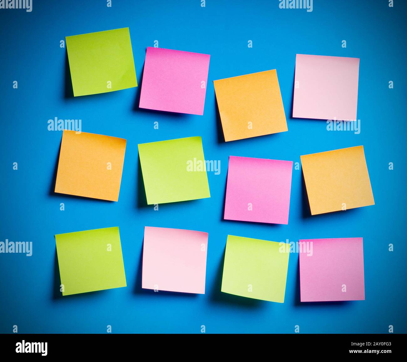 Reminder notes on the bright colorful paper Stock Photo - Alamy