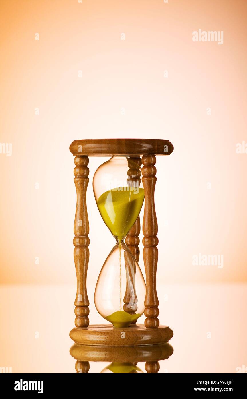 Time concept - hourglass against the gradient background Stock Photo ...
