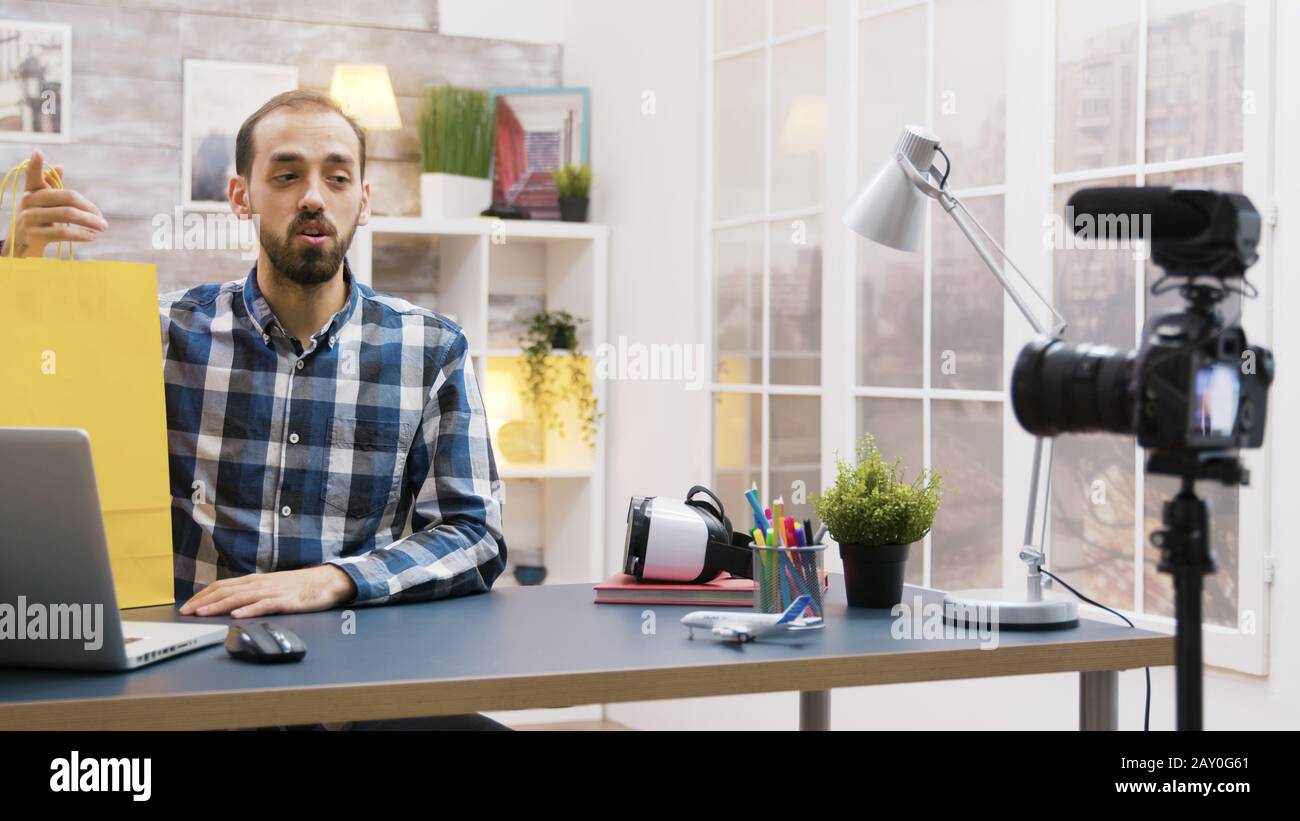 Famous young vlogger making a giveaway on his channel. Vlogger talking ...