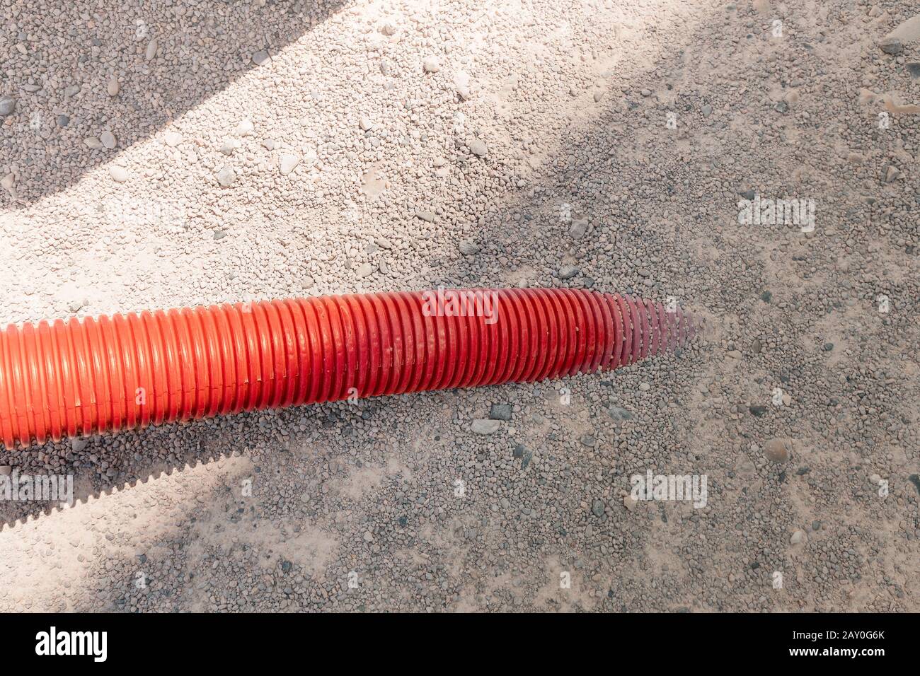 Plastic pipe going through the soil. Industrial and pumping concept ...