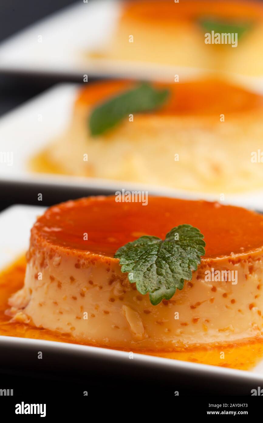 Cream caramel on square plates Stock Photo - Alamy