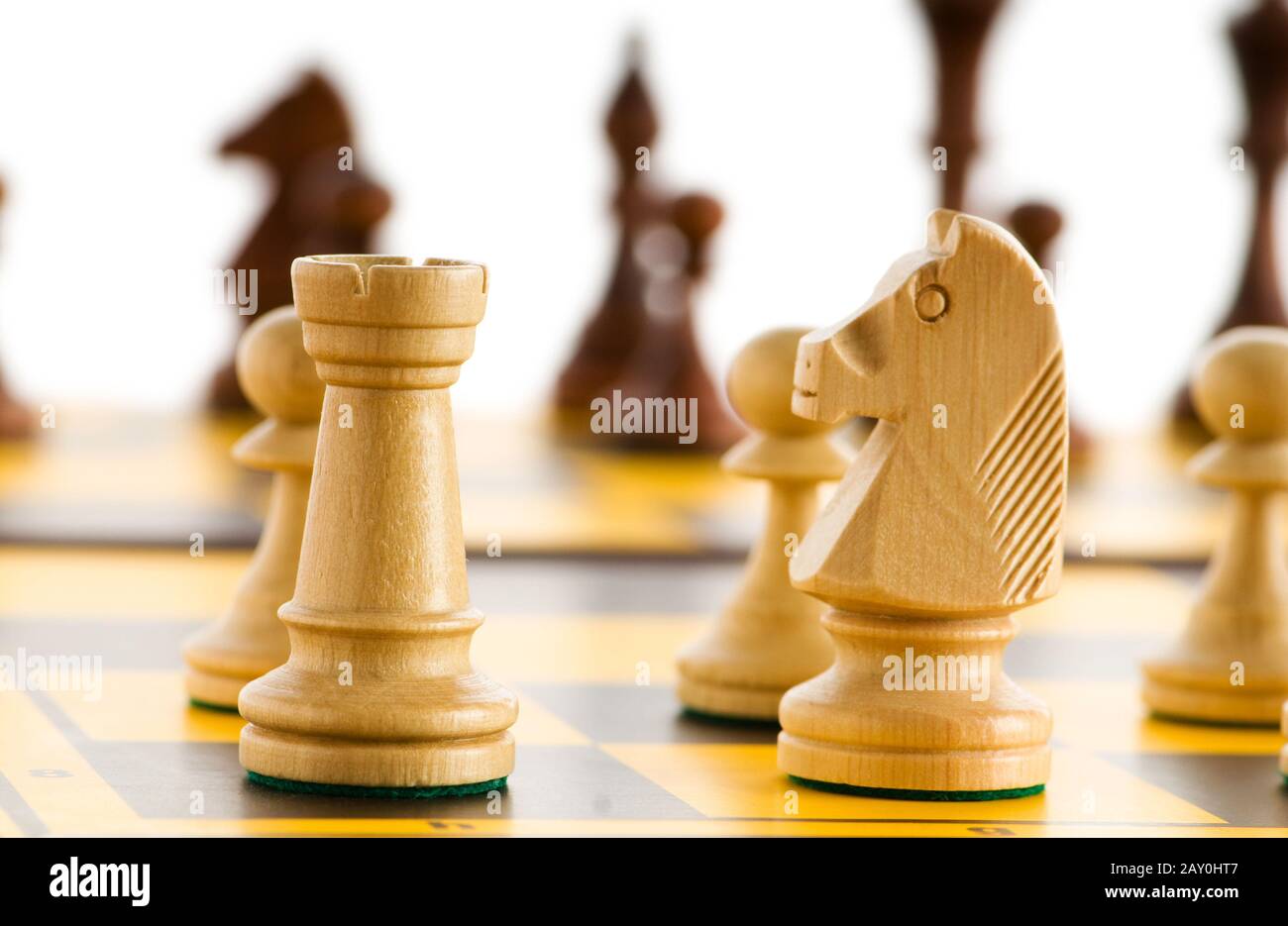 Set of chess figures on the playing board Stock Photo - Alamy