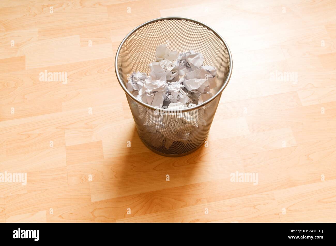 Garbage bin with paper waste isolated on white Stock Photo - Alamy