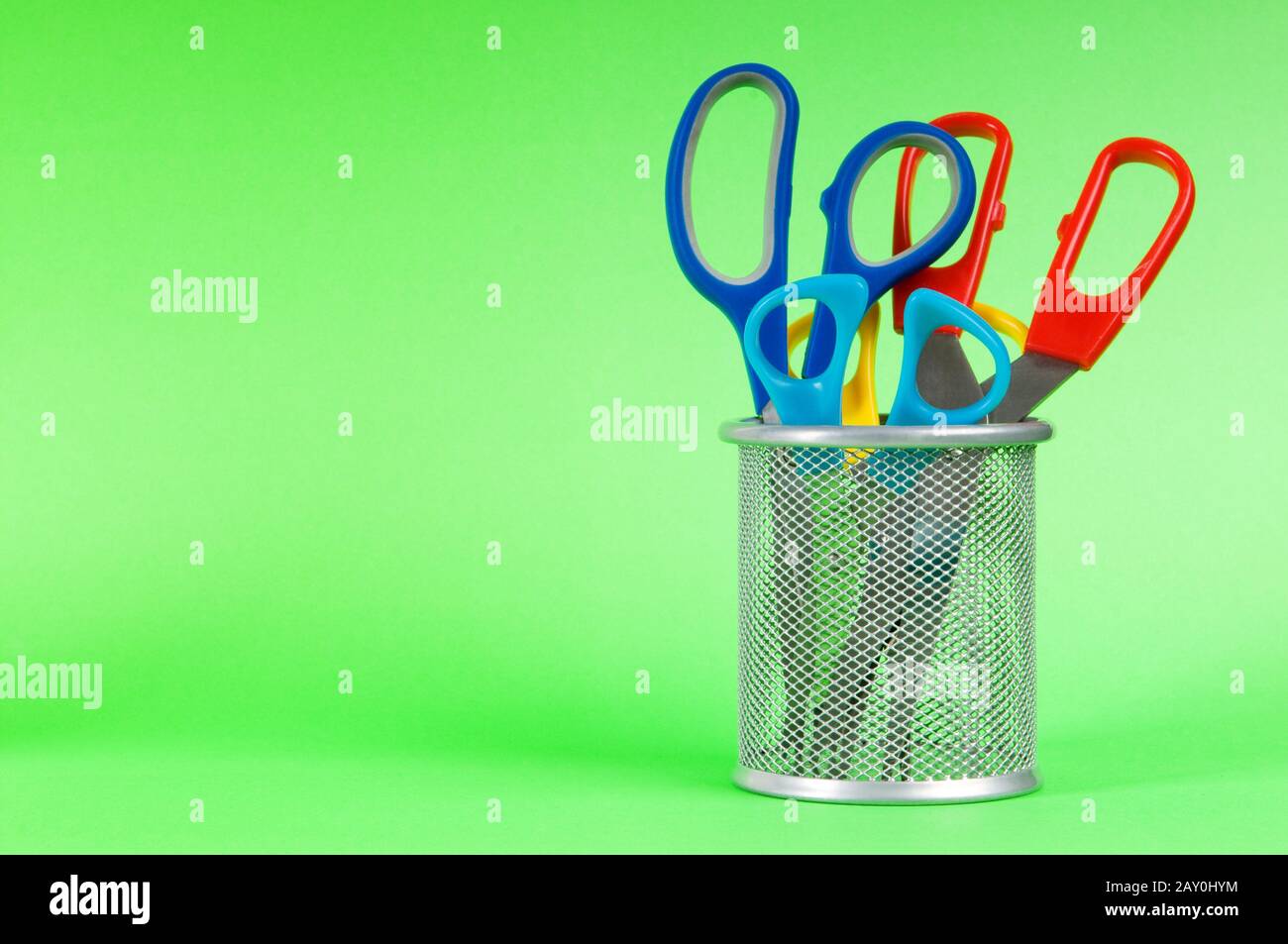 Colorful scissors on the color paper background Stock Photo - Alamy