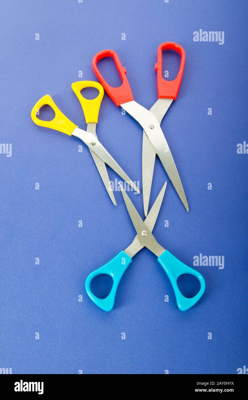 Colorful scissors on the color paper background Stock Photo - Alamy