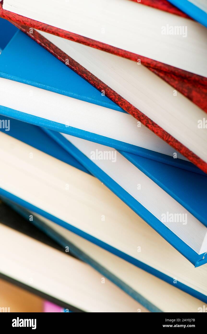 Stack of text books against gradient background Stock Photo - Alamy