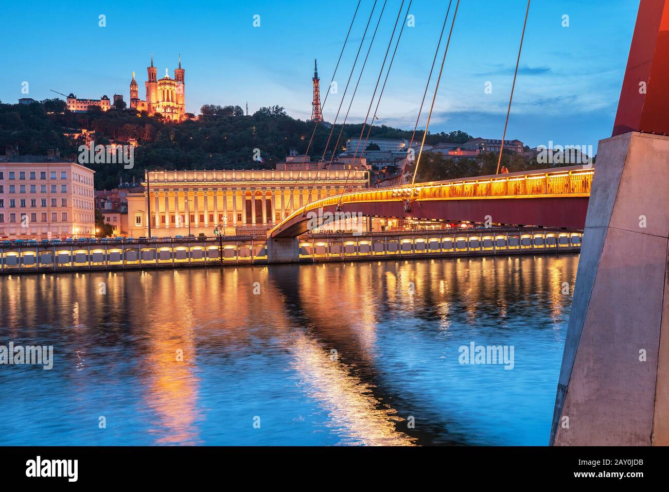 Lyon night cityscape with illuminated Courthouse and red pedestrian ...