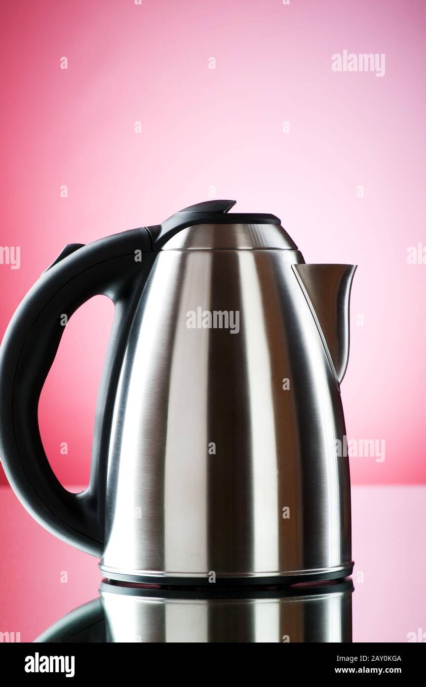 Shiny kettle against the colorful gradient background Stock Photo - Alamy