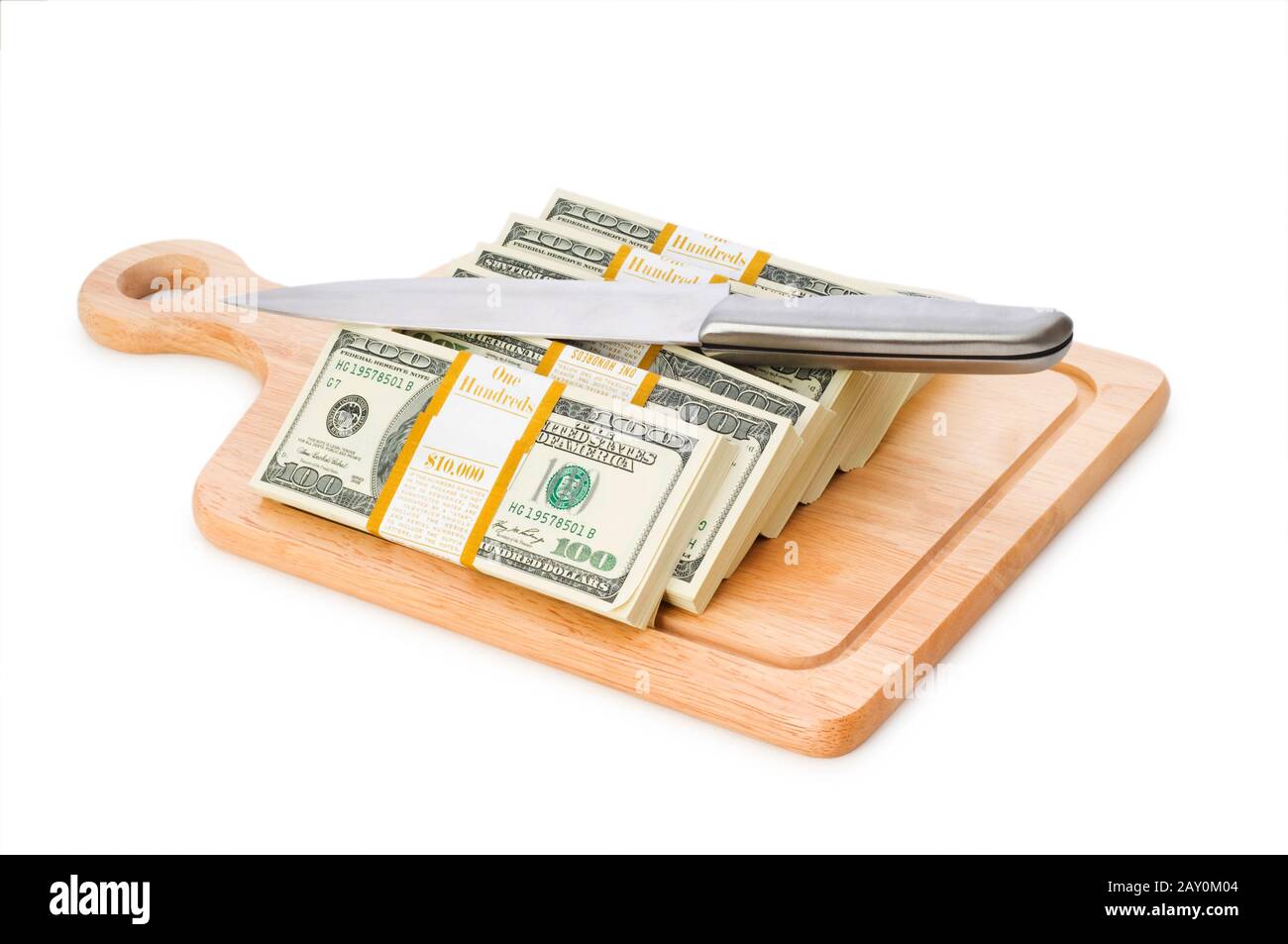 Money concept - cutting dollars with the knife Stock Photo - Alamy