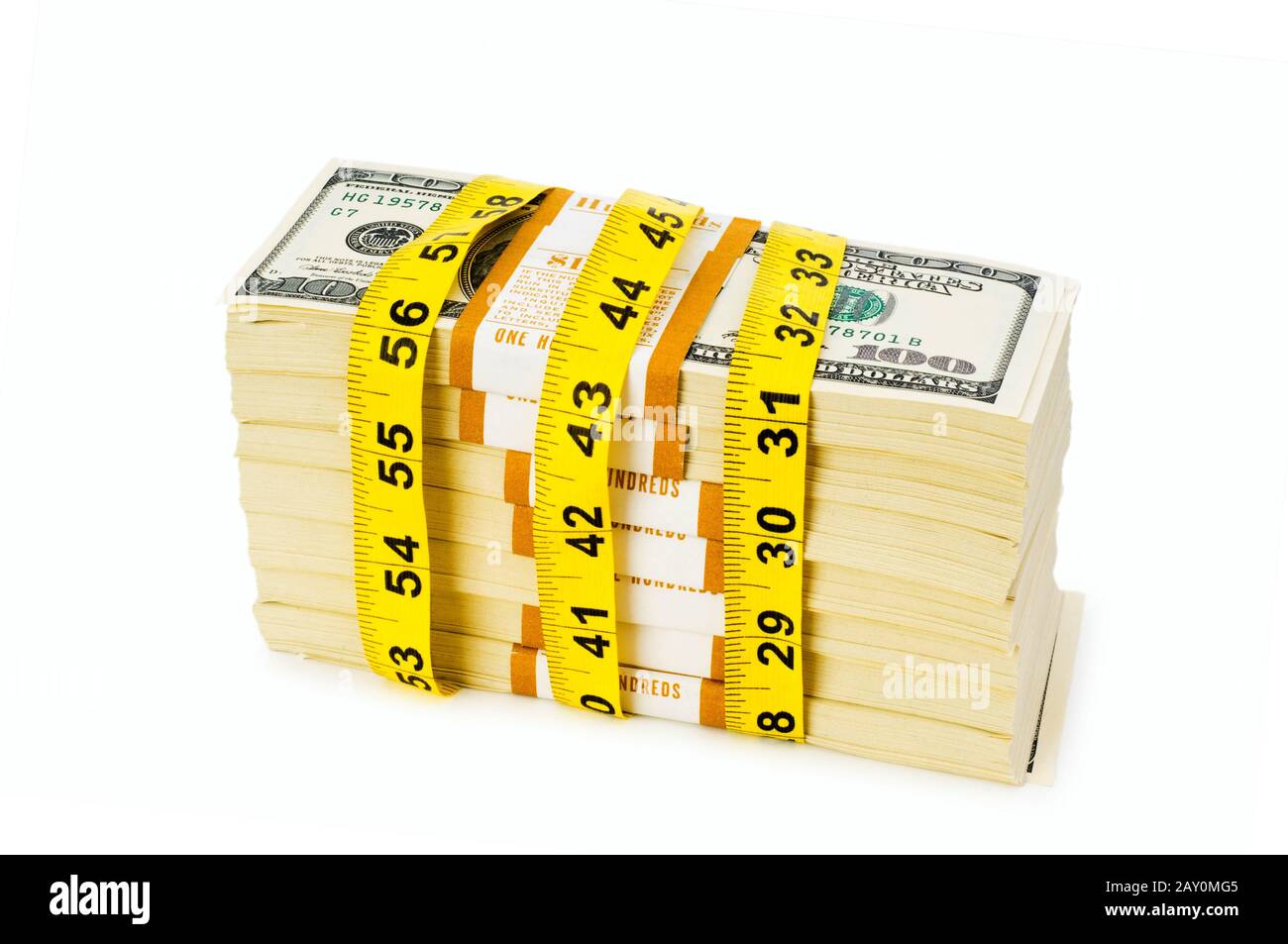 Financial concept - measuring money isolated on white Stock Photo - Alamy