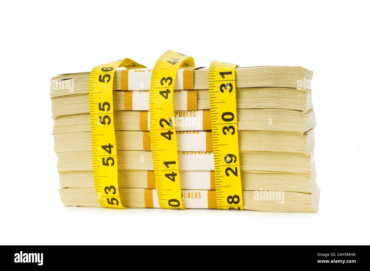 Financial concept - measuring money isolated on white Stock Photo - Alamy