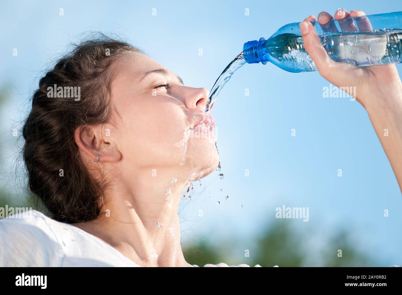 Beautiful woman drinking water. Thirst Stock Photo - Alamy