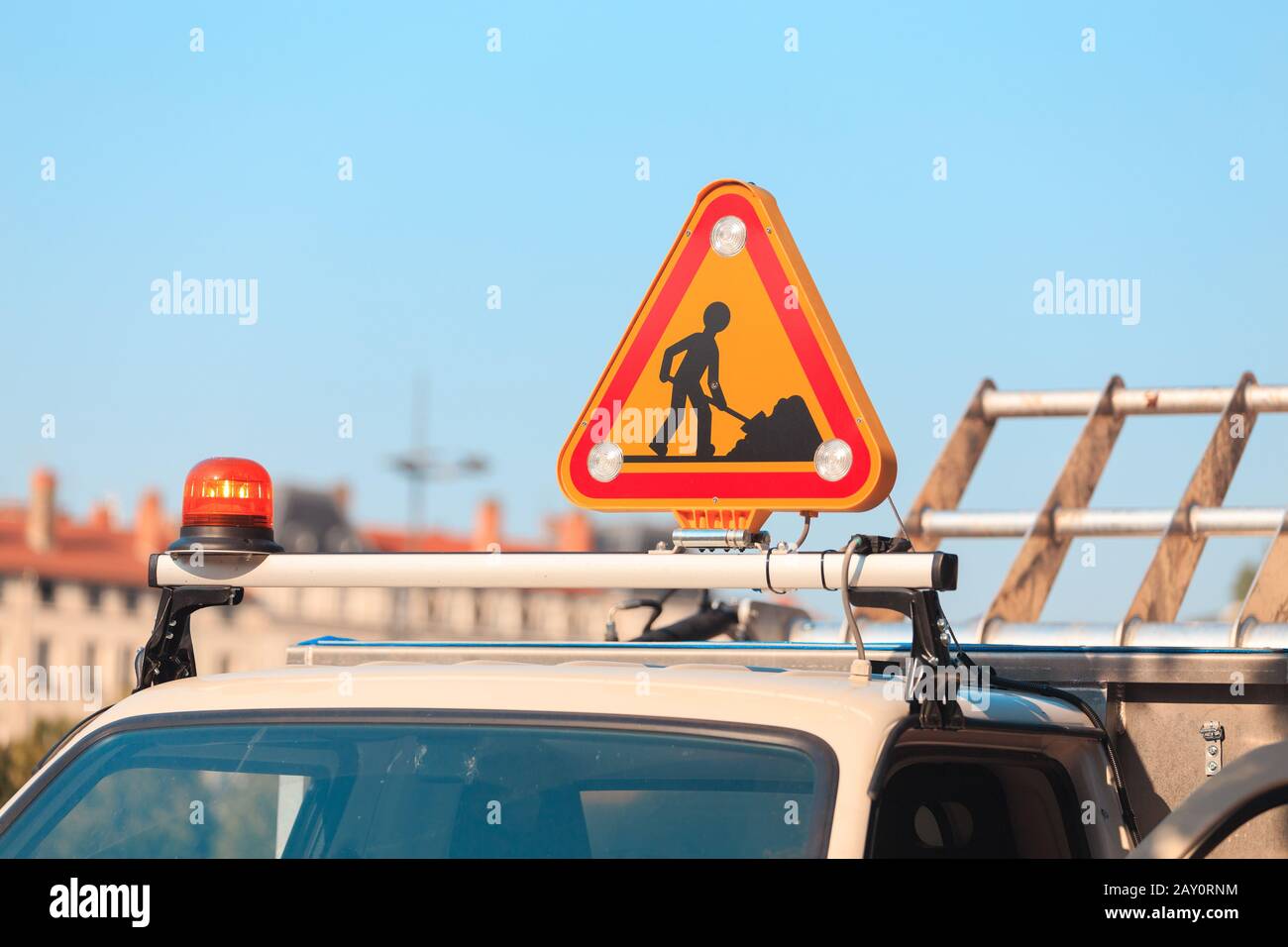 Construction and repair work sign on a service car Stock Photo - Alamy