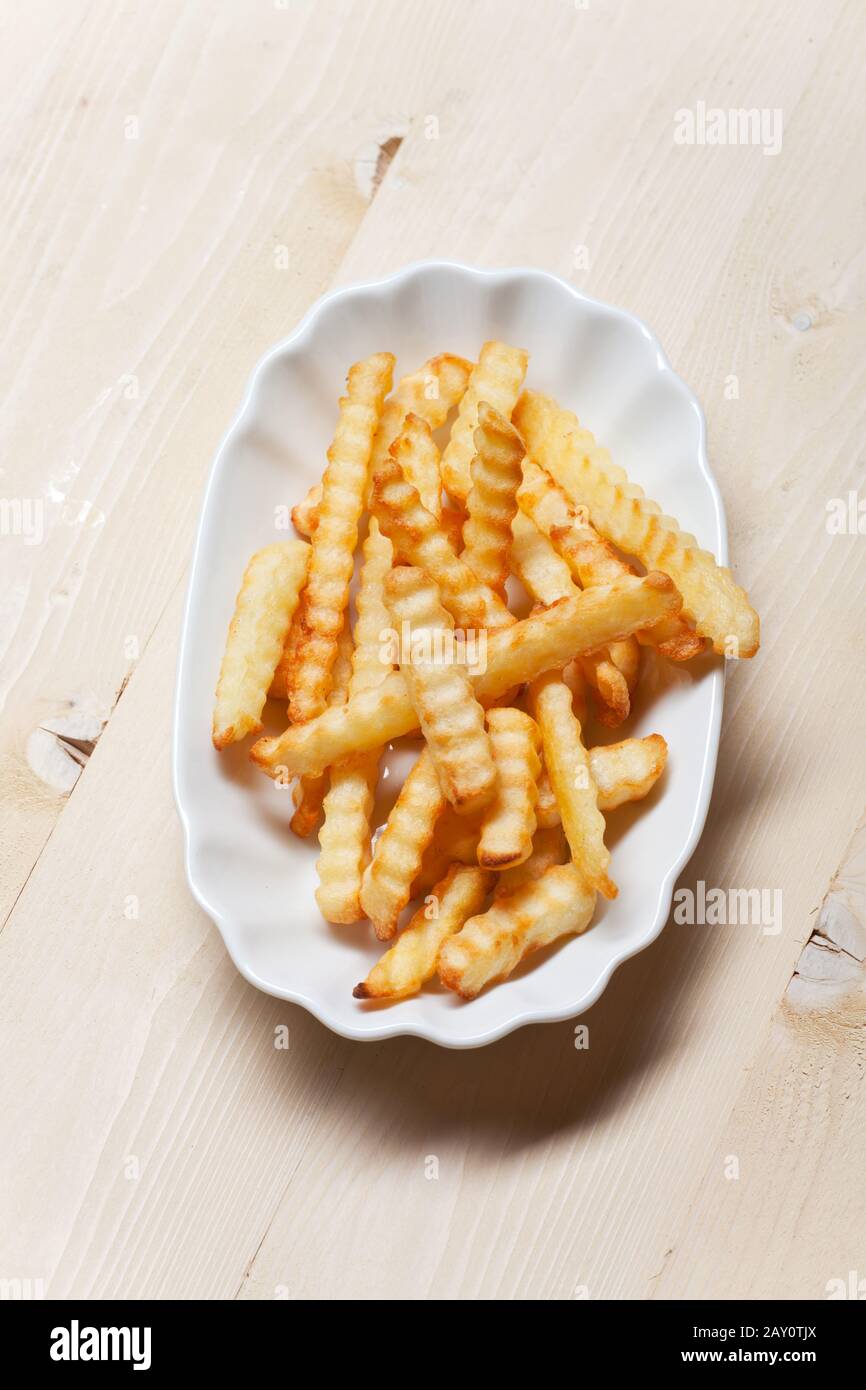 French fries on a fork Stock Photo - Alamy