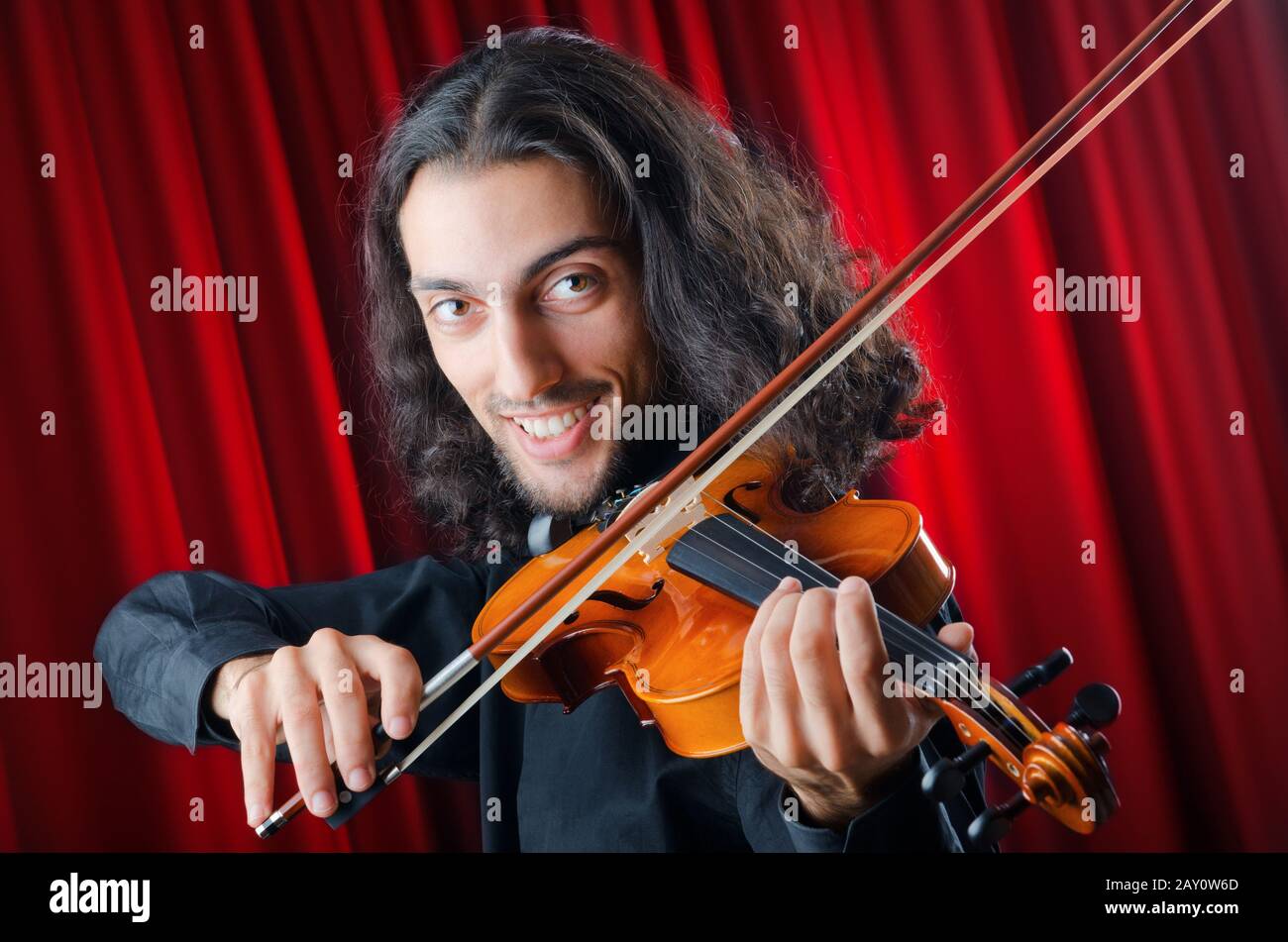 Violin player playing the intstrument Stock Photo - Alamy