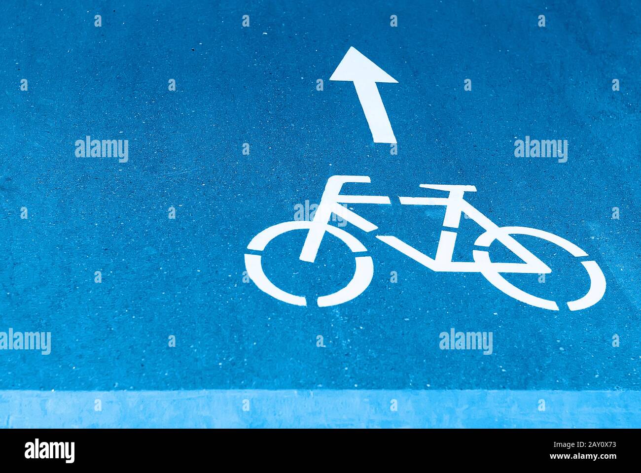 The sign of the cycle track on the asphalt and the direction of ...