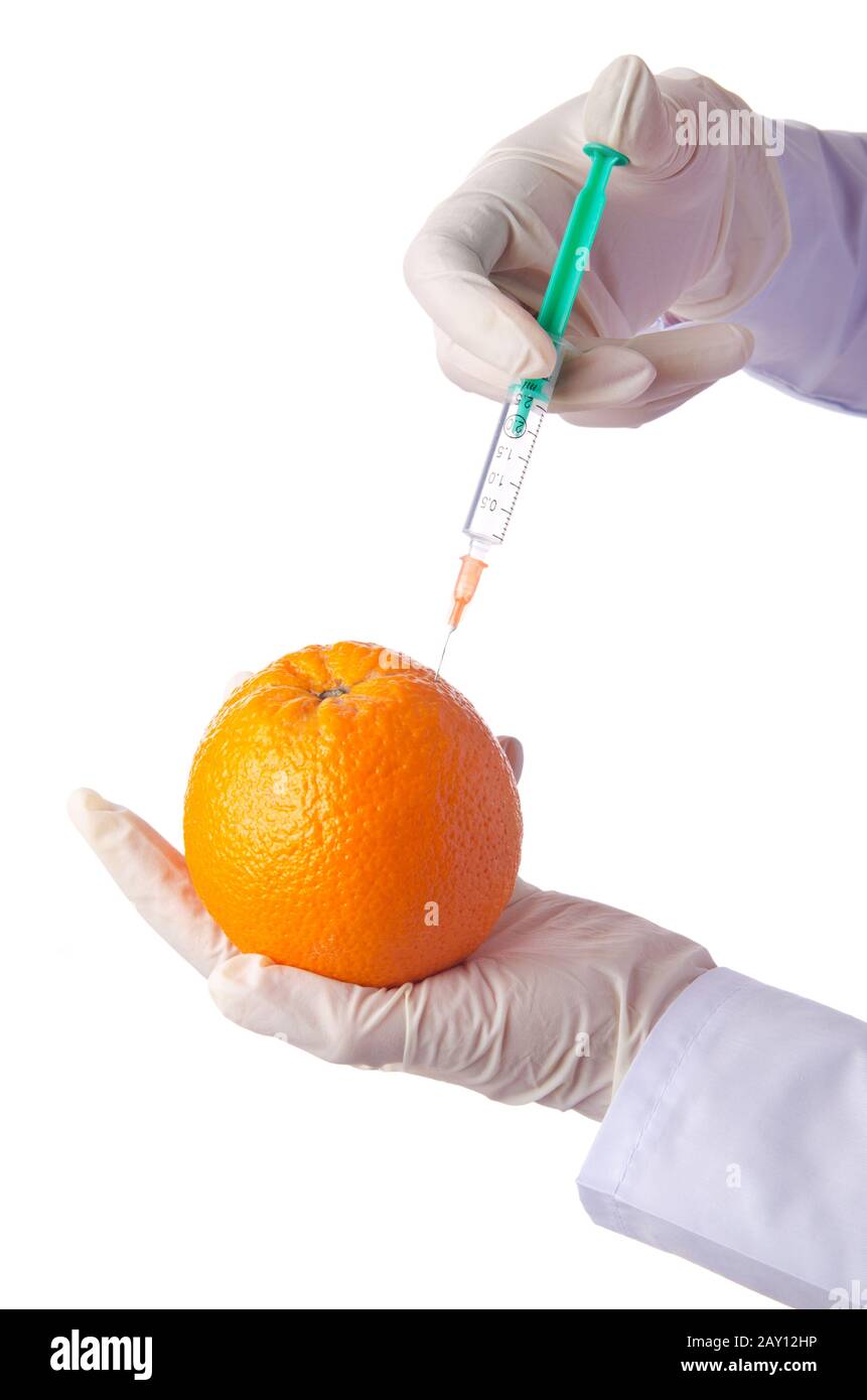 Science experiment with orange and syringe Stock Photo - Alamy