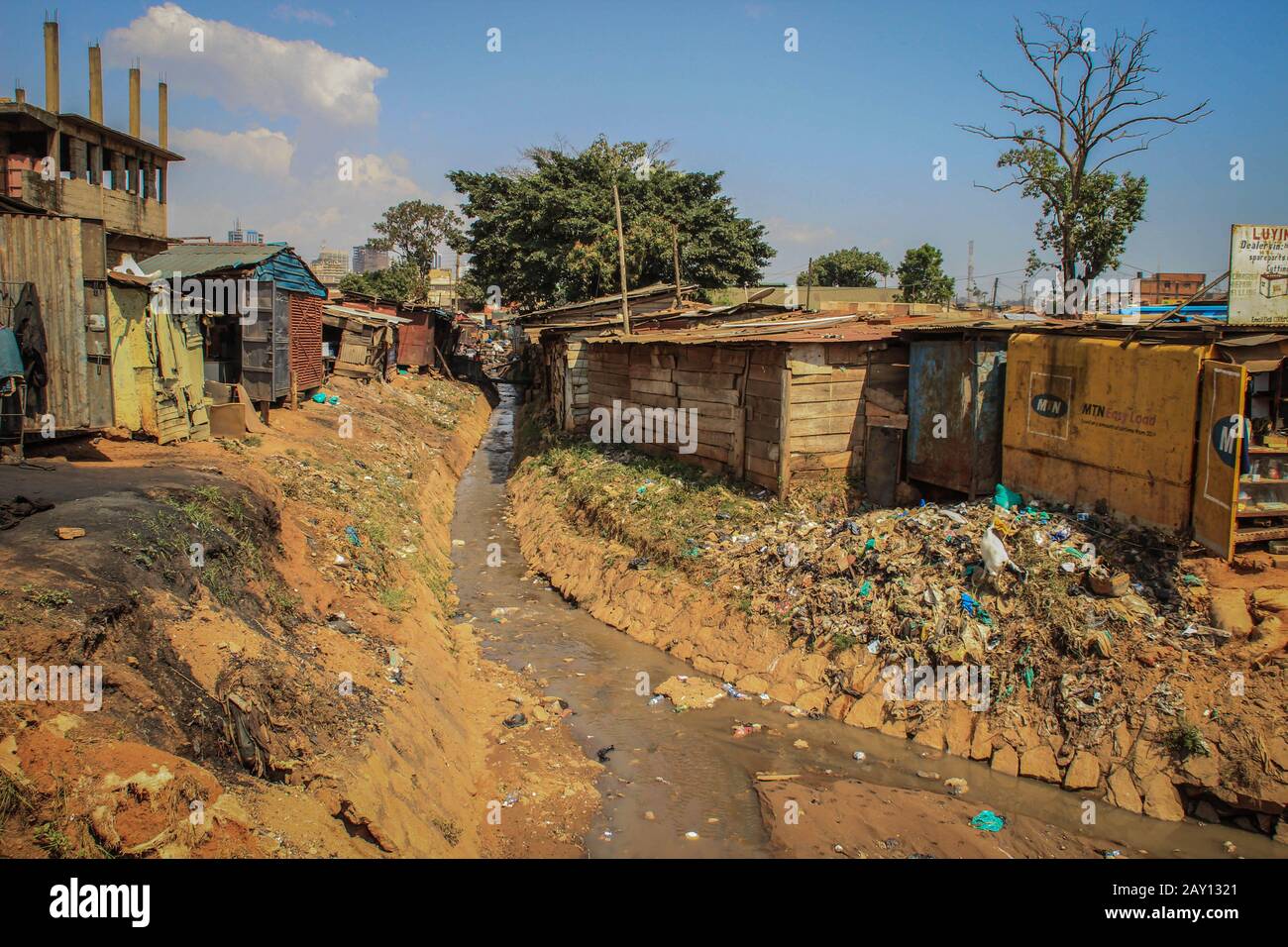 Kampala, Uganda - January 22, 2015: A very dirty river with rubbish and ...