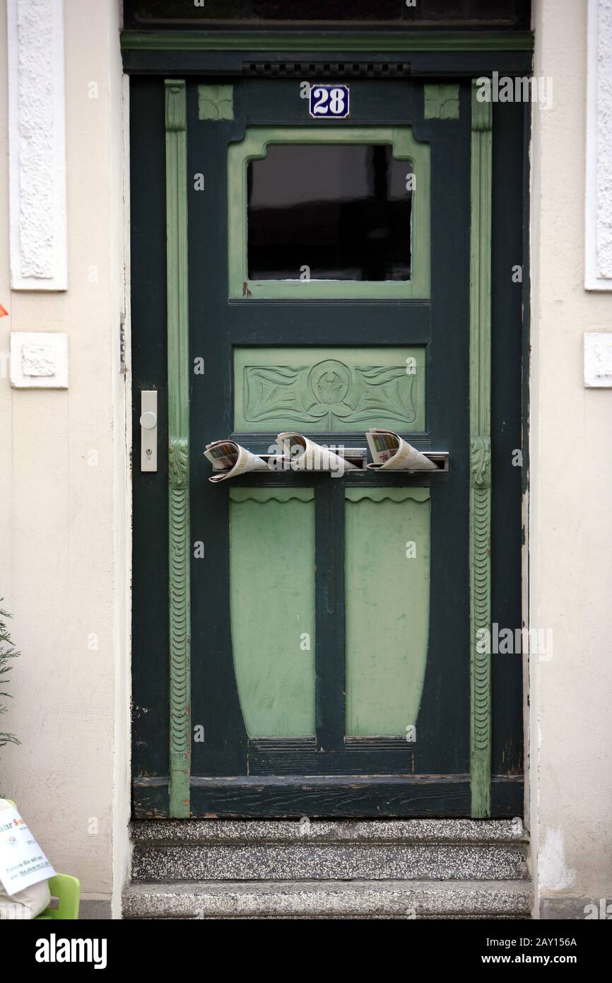 Advertising mail in the letter slots Stock Photo - Alamy
