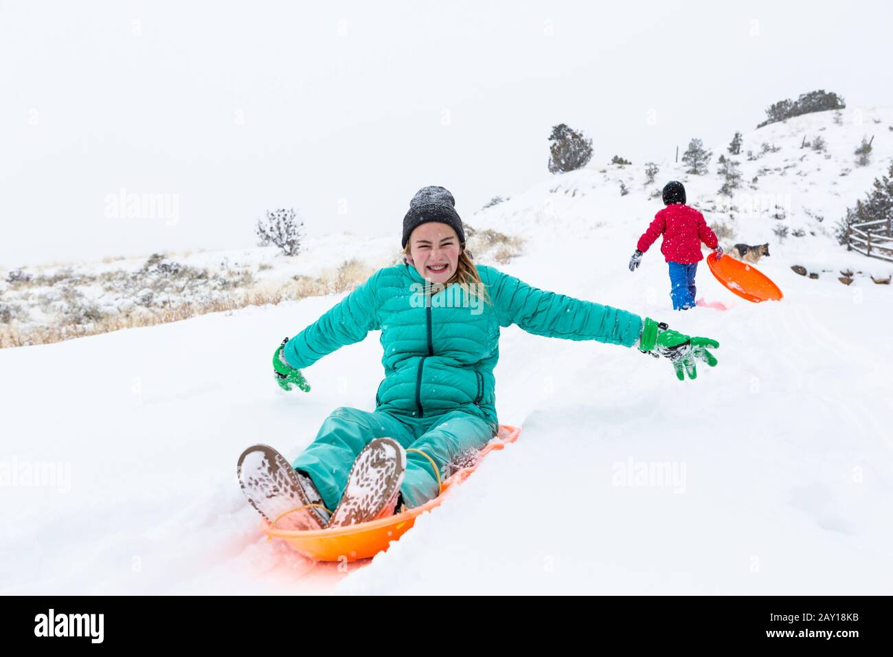Teen boy sledding down hi-res stock photography and images - Alamy