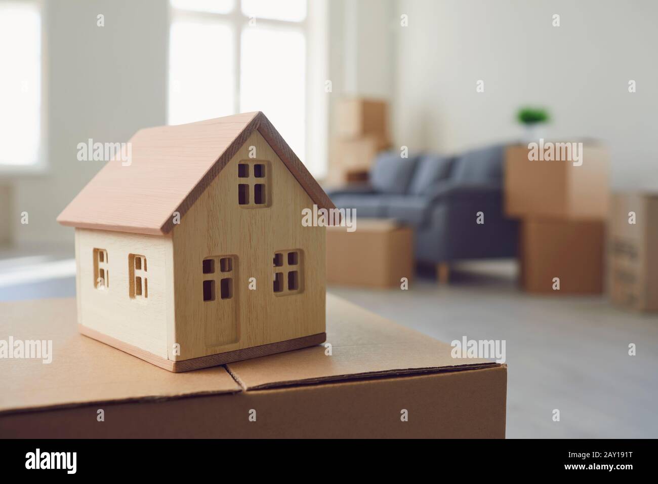 Model of the house on the floor in the new bright sunny house Stock ...