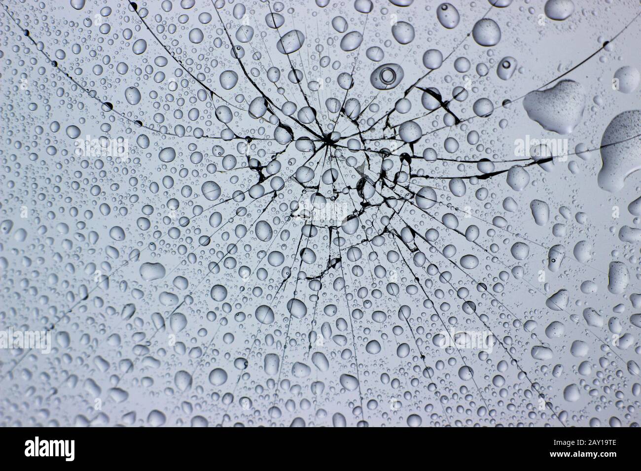 Dew drops on cracked broken window glass Stock Photo - Alamy