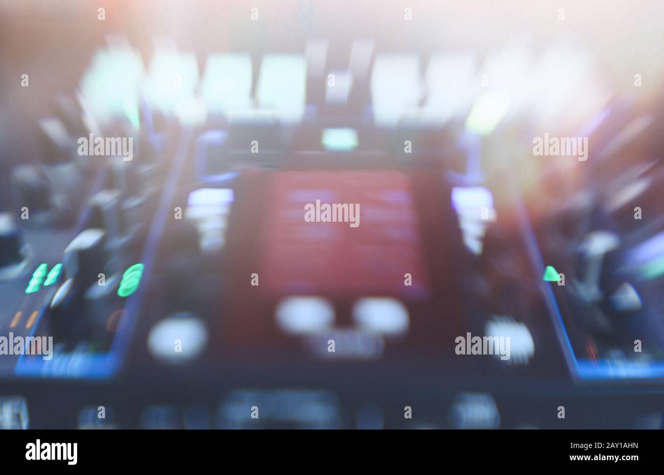 Blurred background with dj sound mixer panel on concert stage in ...