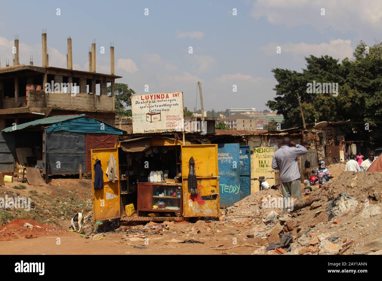 Kampala, Uganda - February 3, 2015: Street and shops in the slums of ...