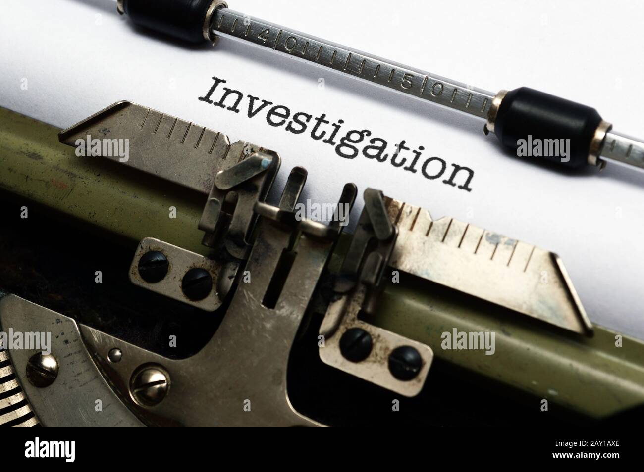 Investigation text on typewriter Stock Photo - Alamy