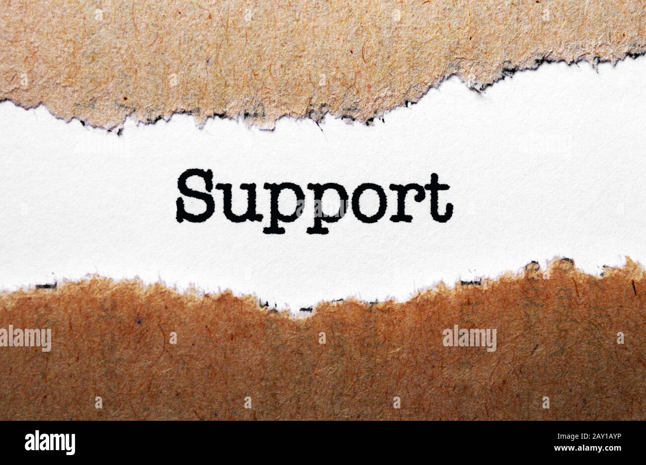 Support text on torn paper Stock Photo - Alamy