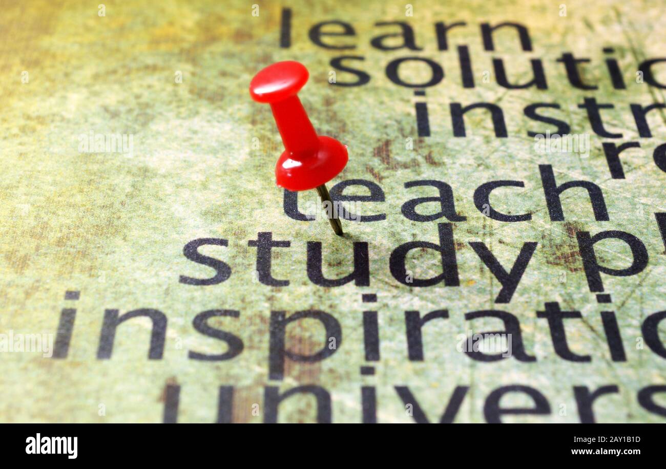 Push pin on study text Stock Photo - Alamy