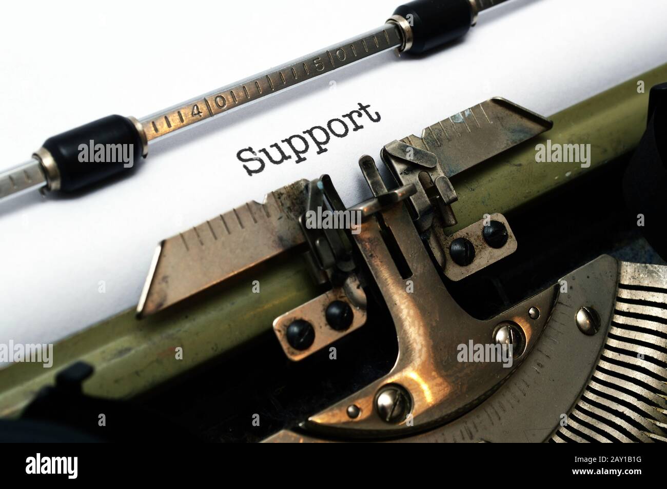 Support text on typewriter Stock Photo - Alamy
