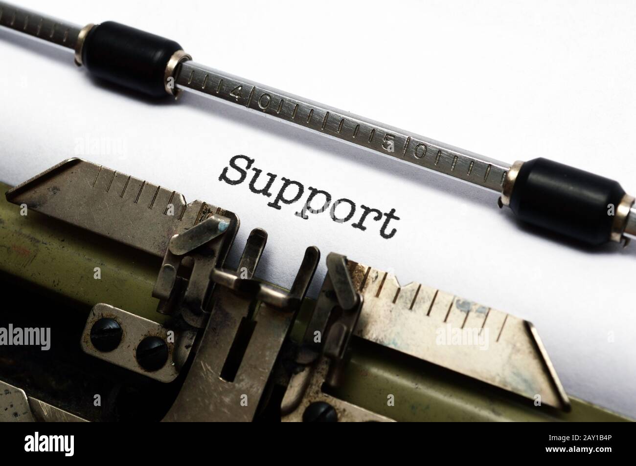 Support text on typewriter Stock Photo - Alamy