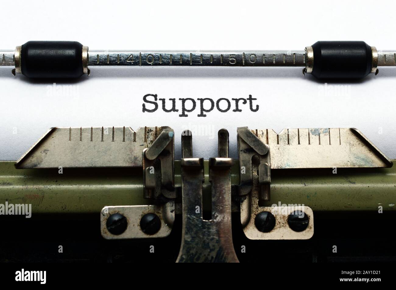 Support on typewriter Stock Photo - Alamy