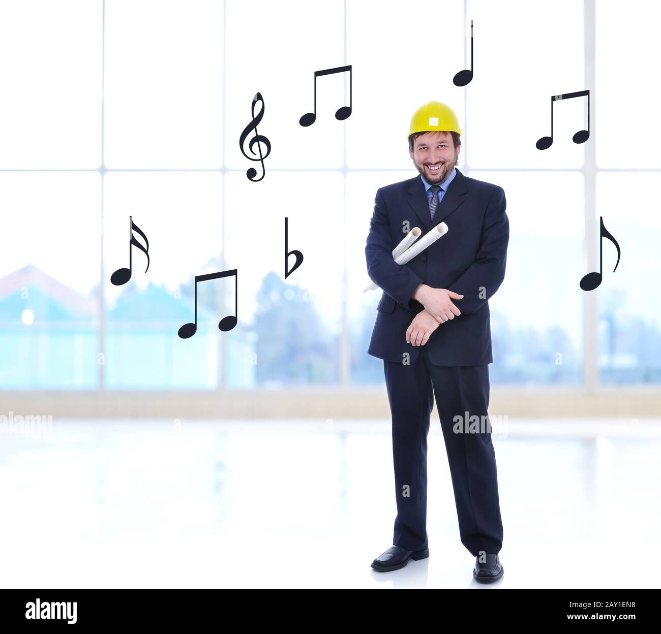 Young caucasian engineer with plans in pose Stock Photo - Alamy