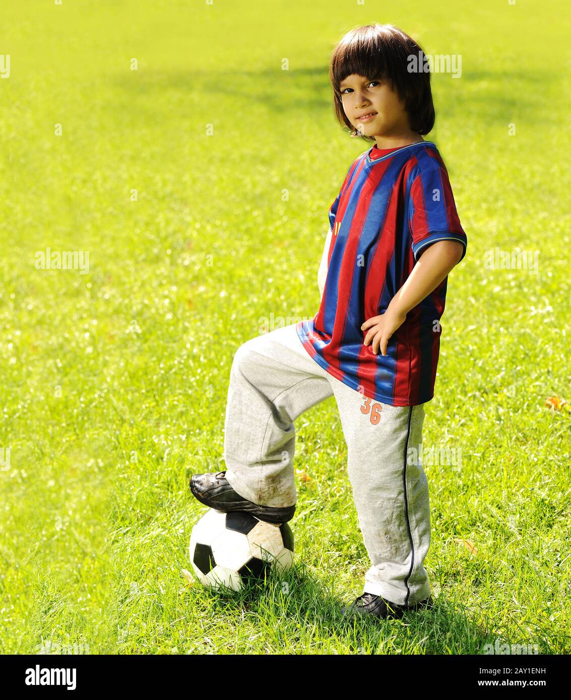 happy kid playing football in a park outdoors Stock Photo - Alamy