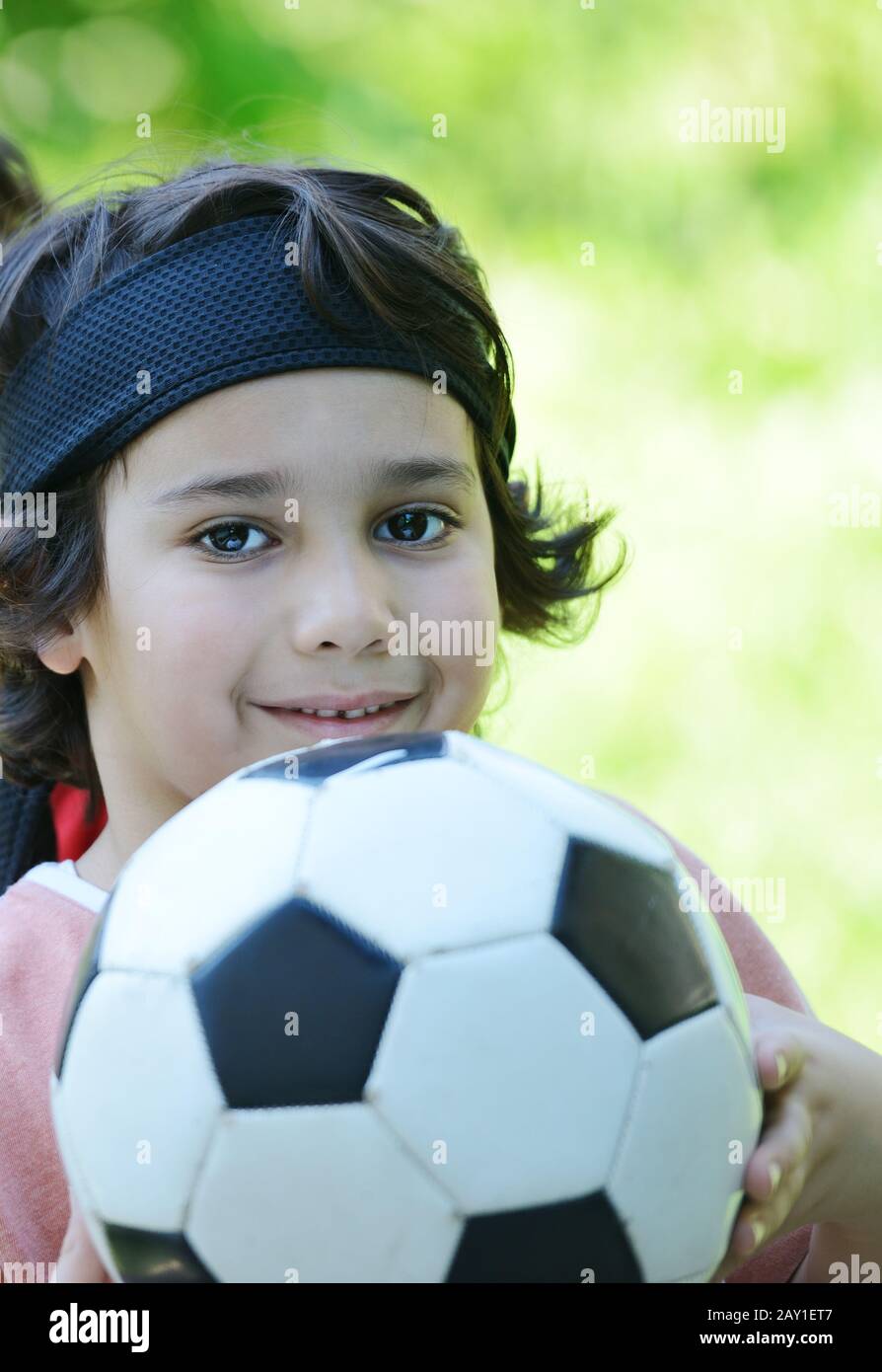 Kid with ball Stock Photo - Alamy