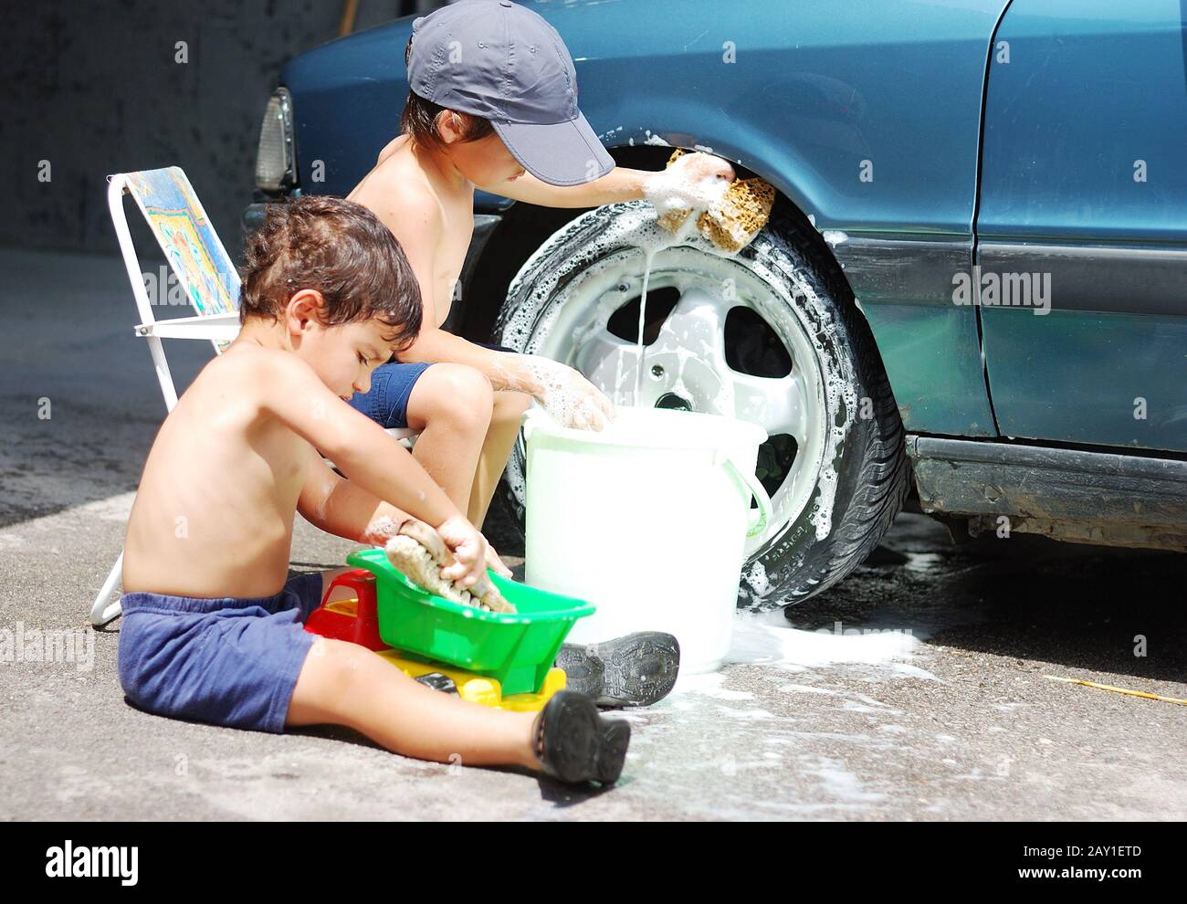 A little cute kid is cleaning car Stock Photo - Alamy