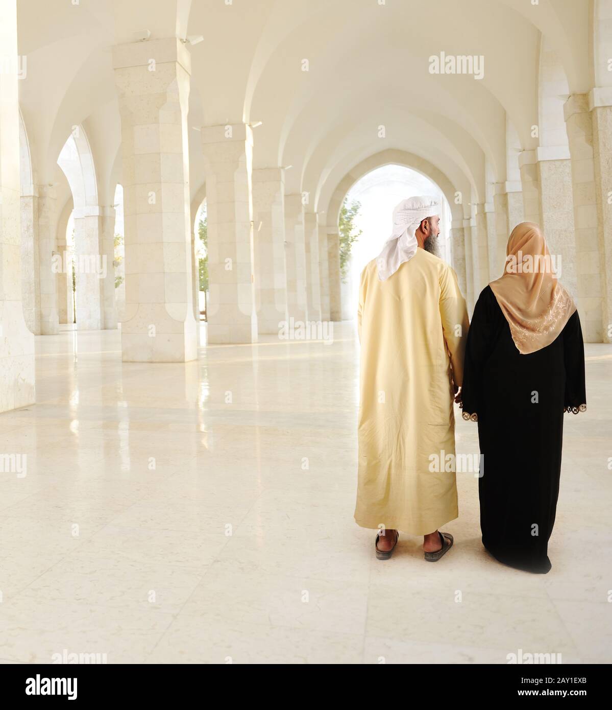 Muslim Arabic couple inside the modern mosque Stock Photo - Alamy