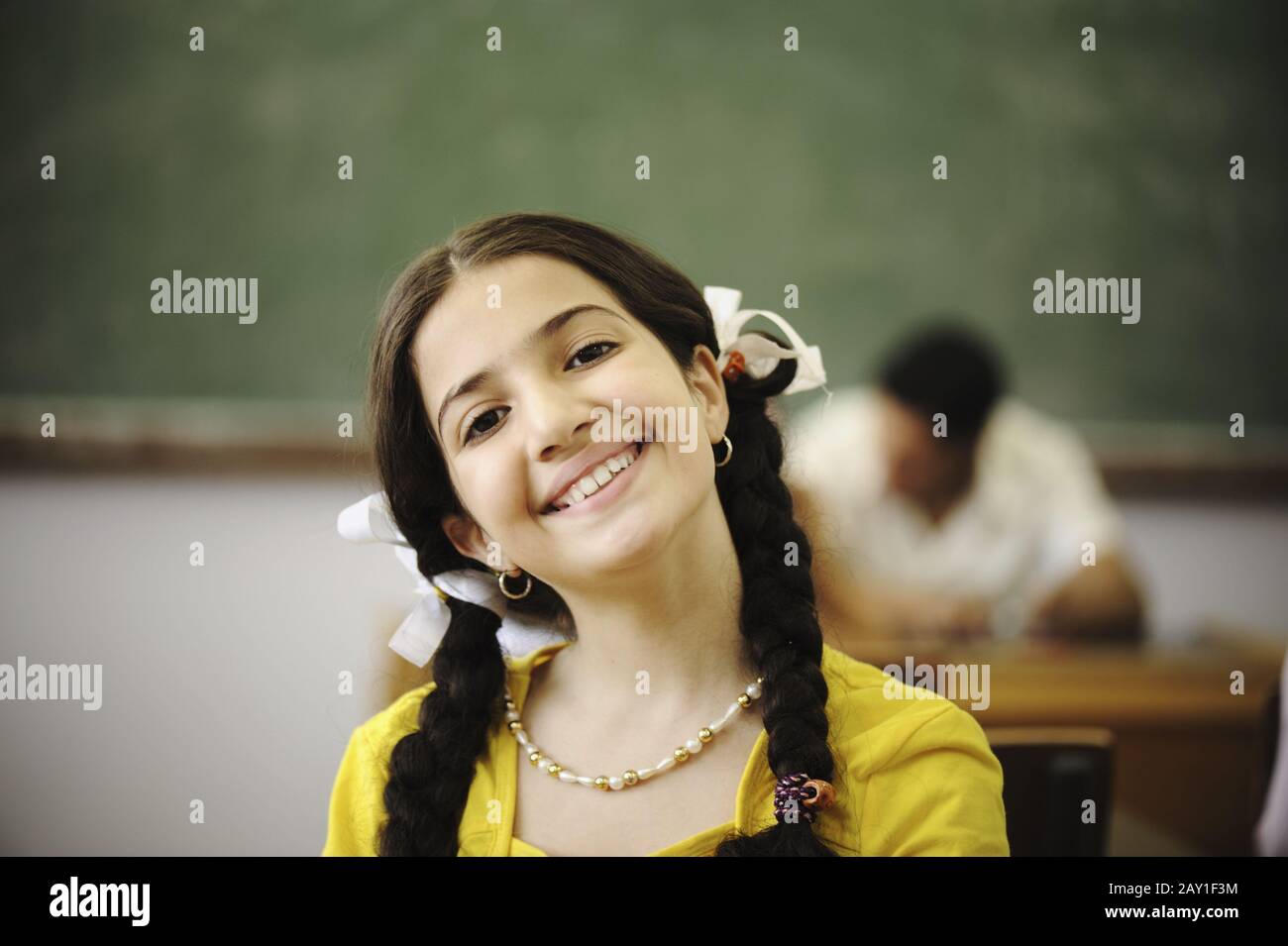 Beautiful little girl in classroom Stock Photo - Alamy