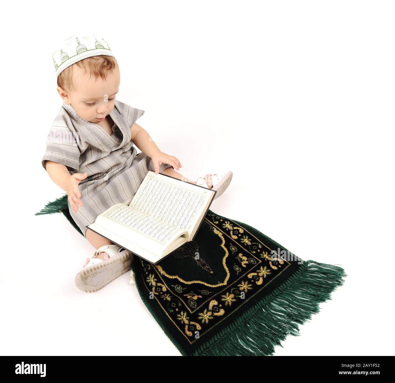 little muslim kid is praying on traditional way Stock Photo - Alamy