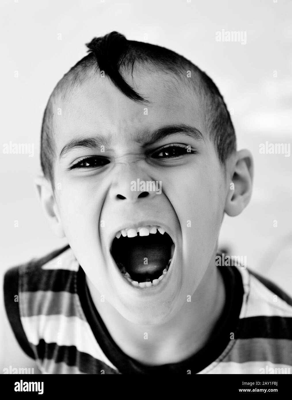 Scary kid screaming Stock Photo - Alamy