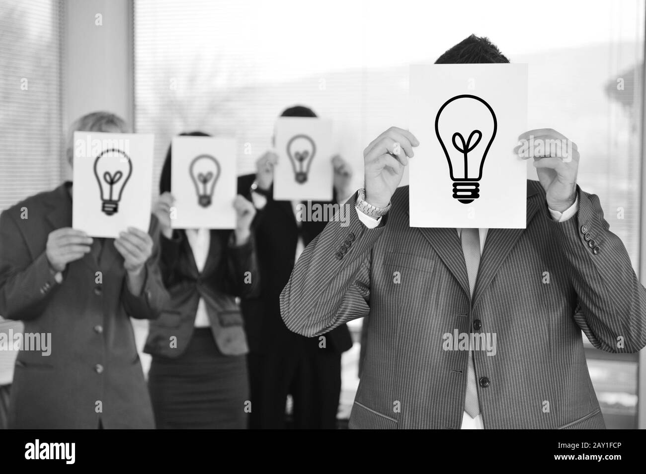 Hand holding group four Black and White Stock Photos & Images - Alamy