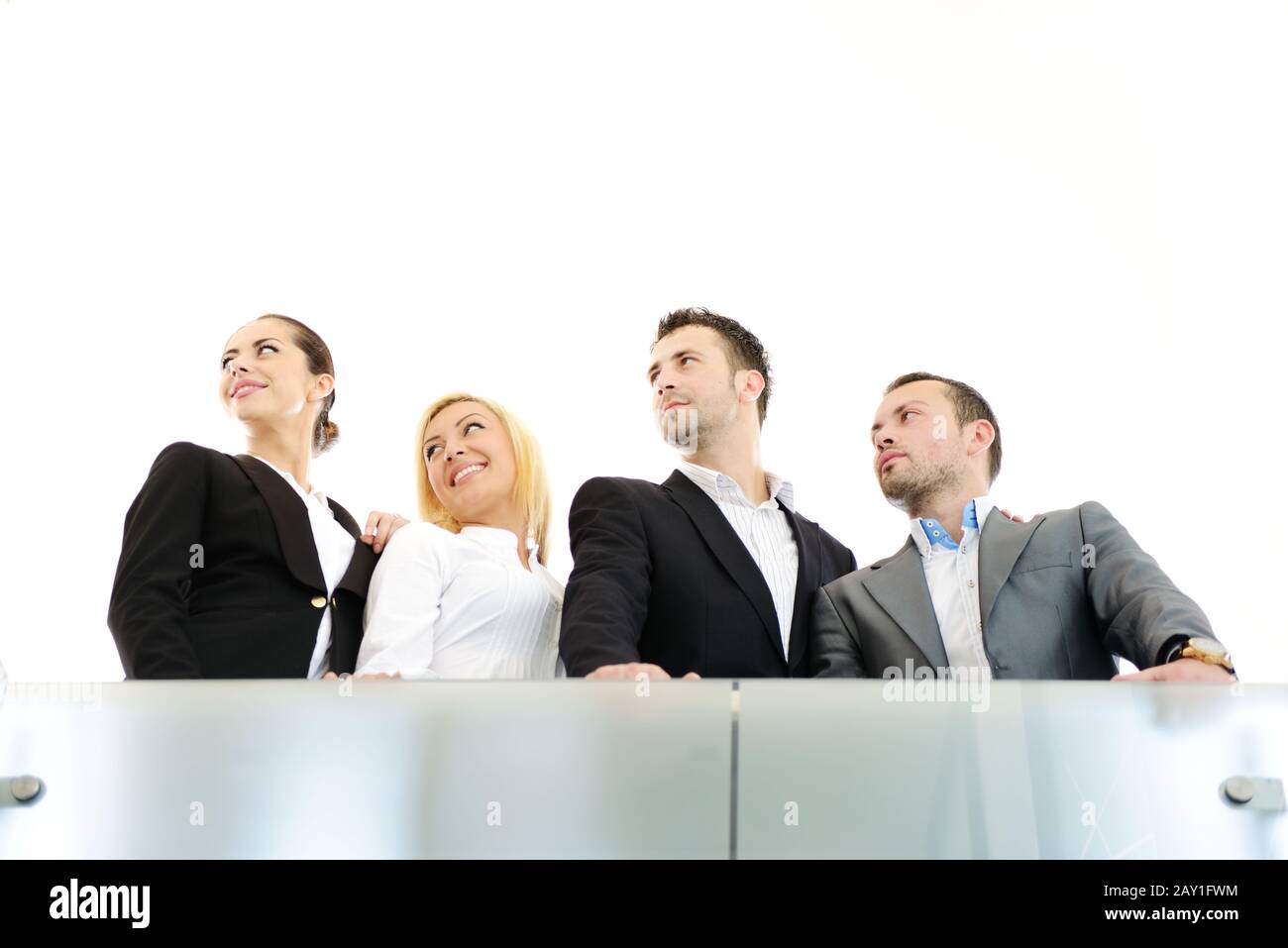 Successful business people on railing Stock Photo - Alamy