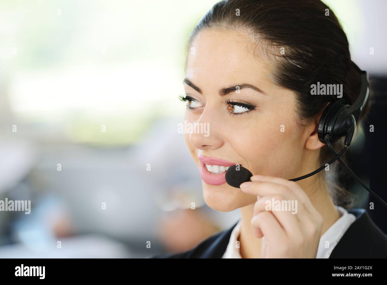 Beautiful support girl in calling centre Stock Photo - Alamy