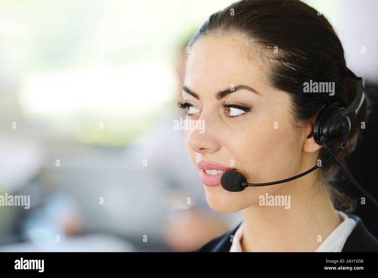 Beautiful support girl in calling centre Stock Photo - Alamy
